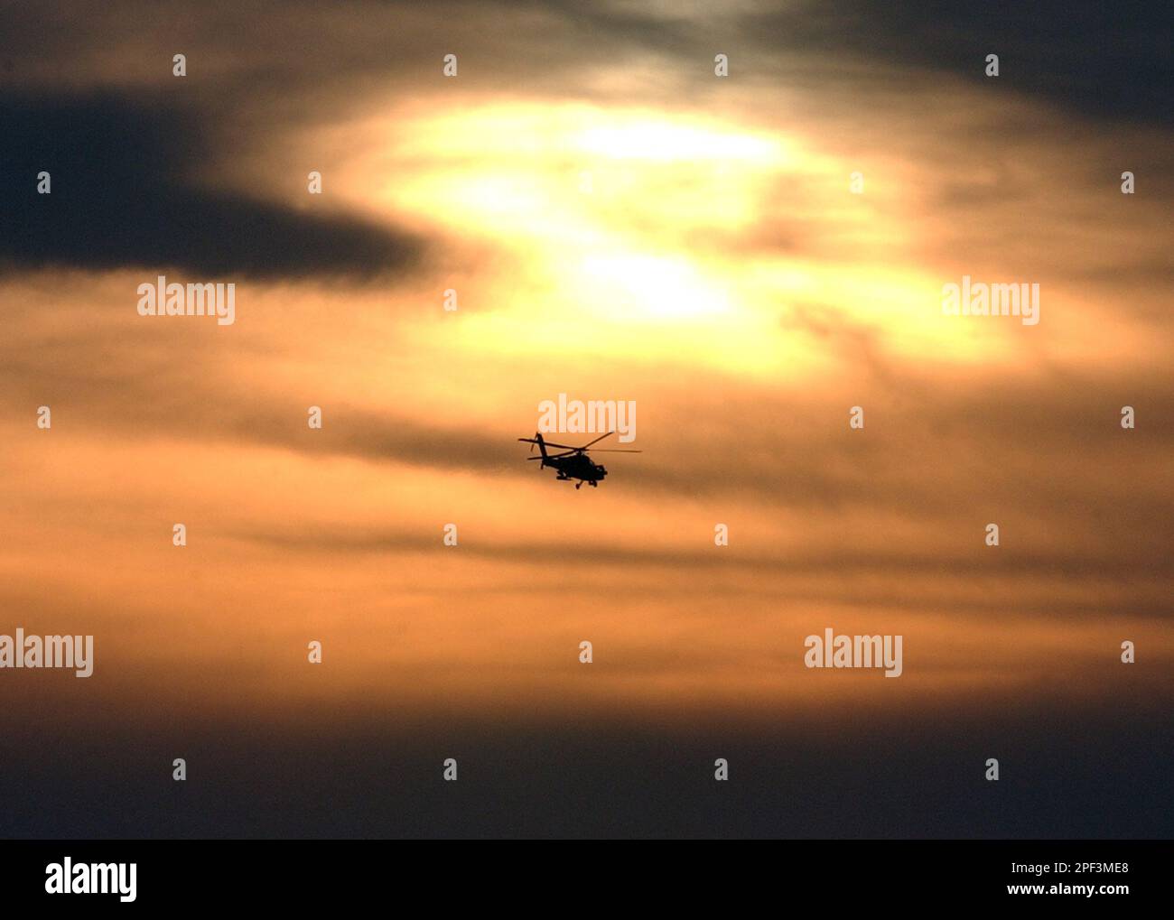 A U.S. Army helicopter flies over Iraqi capital of Baghdad during ...