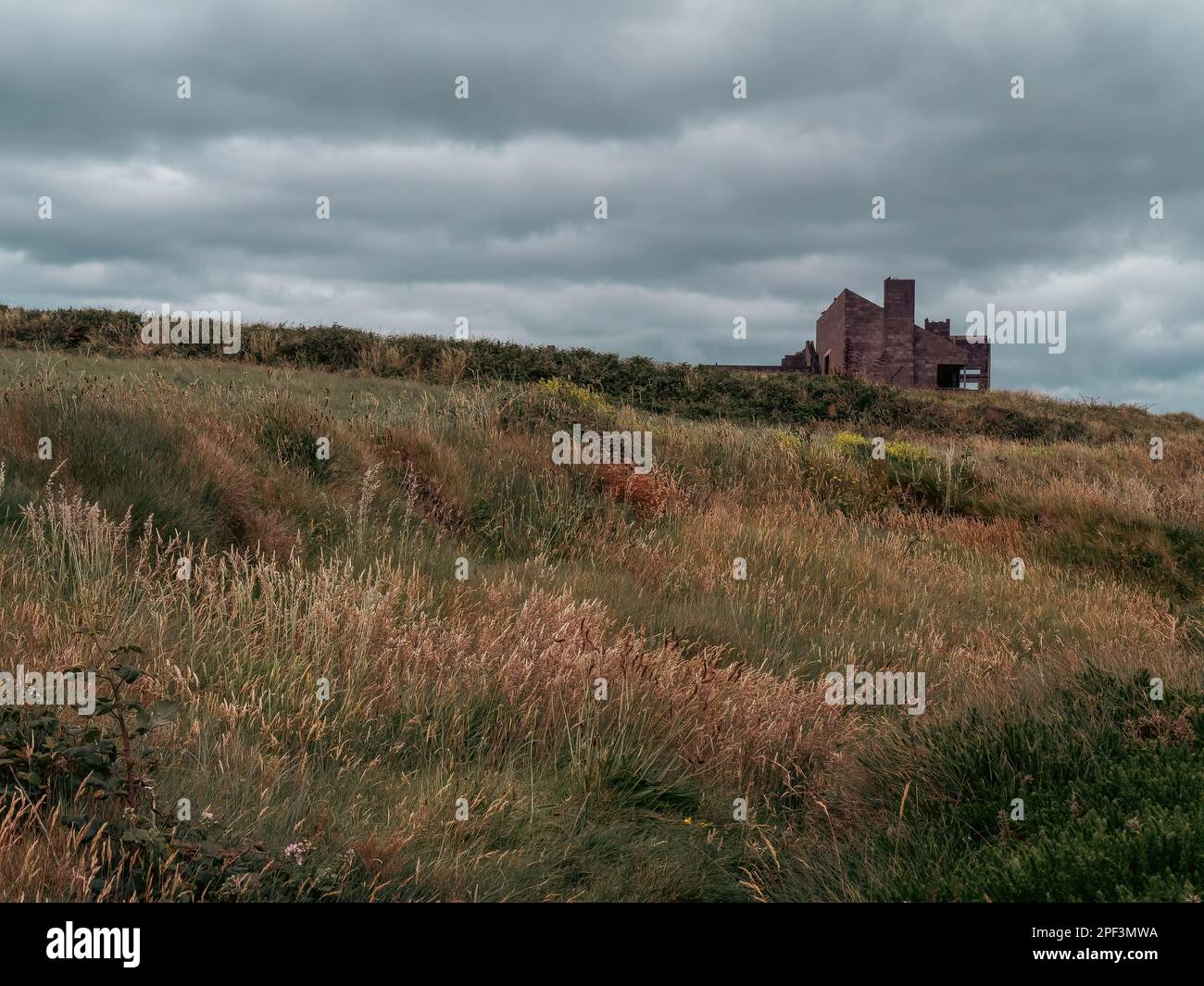 A ruined building under a beautiful dramatic sky. The harsh nature of ...
