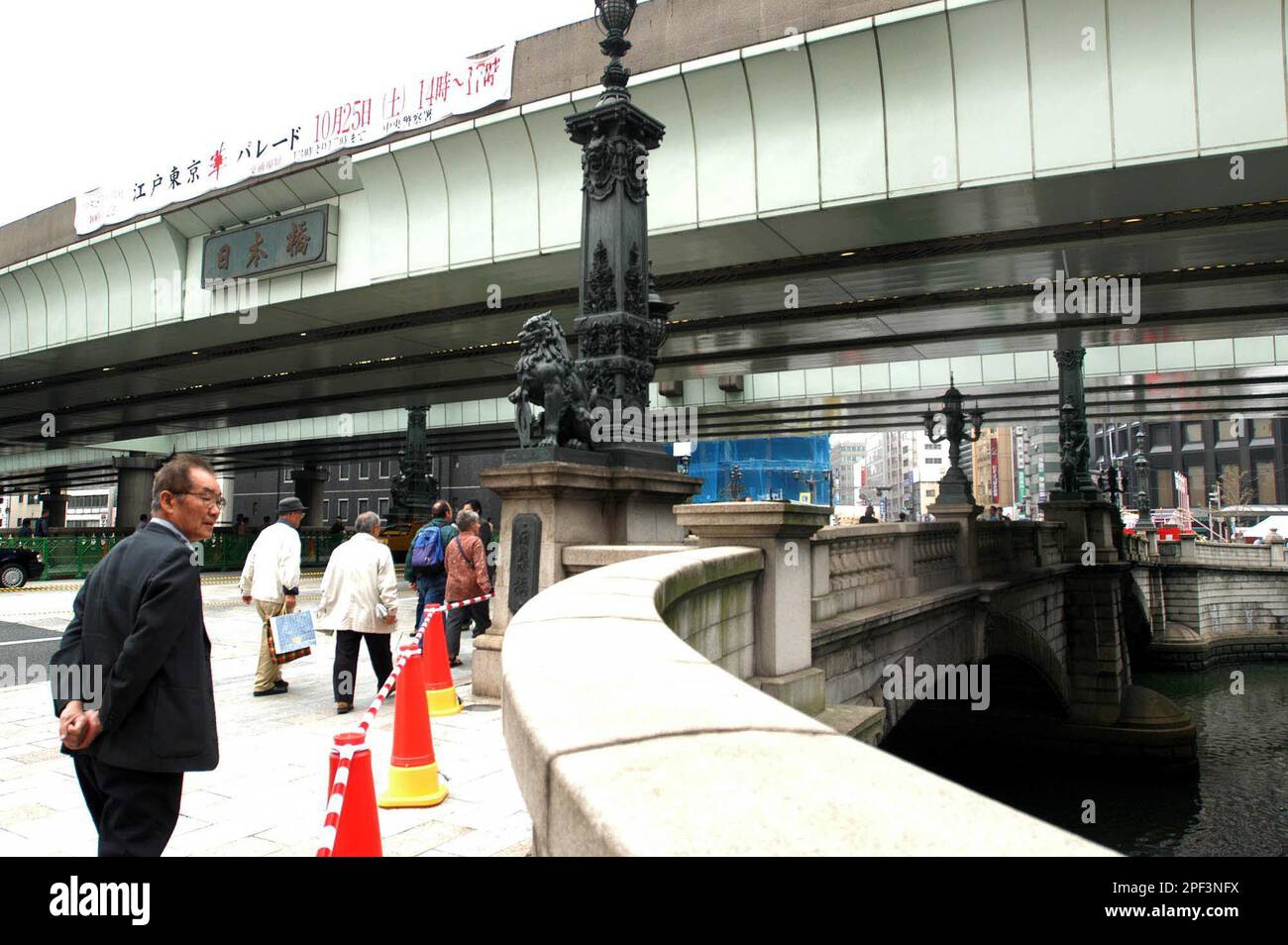 People cross the Nihonbashi bridge, Tokyo's most famous historical ...