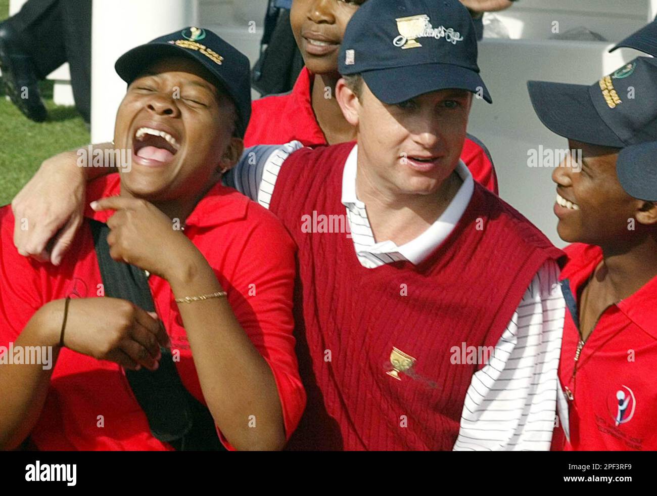 United States golfer David Toms, center, shares a joke with young ...