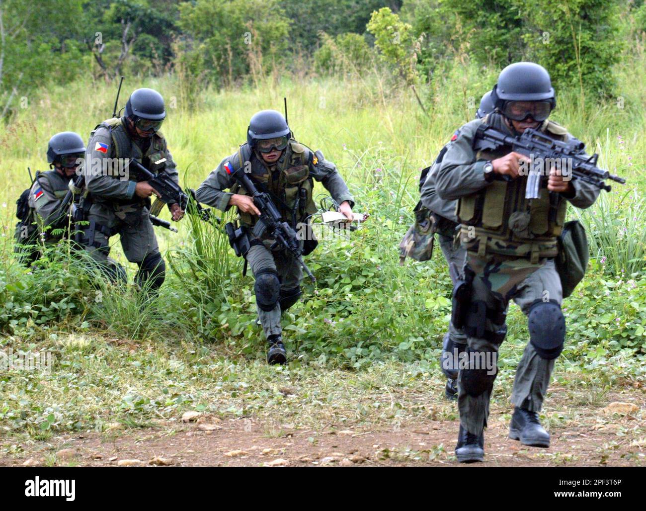 Soldiers from the Philippine Army's Light Reaction Company prepare to ...