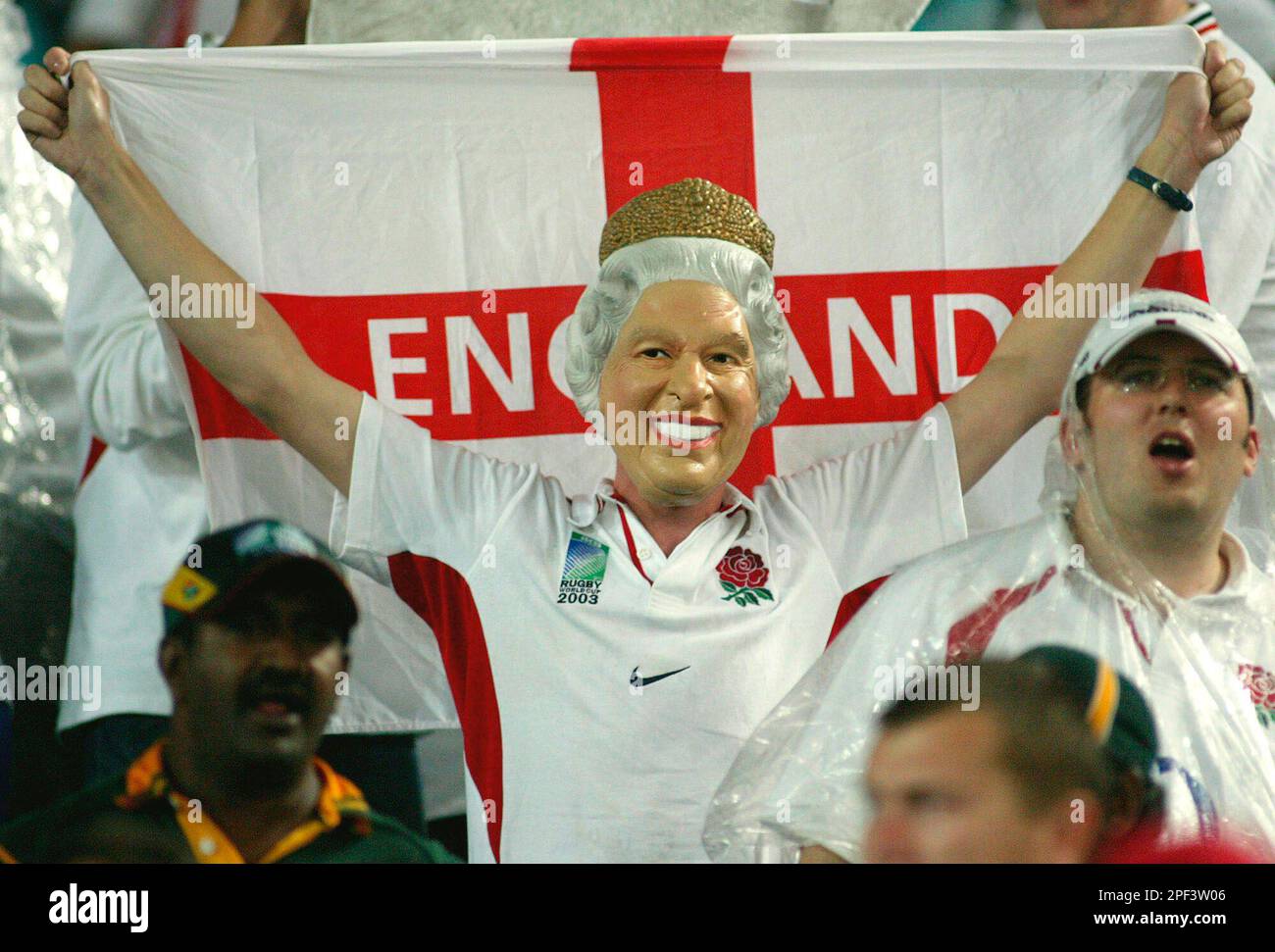 An England fan wearing a mask caricature of Britain's Queen Elizabeth ...