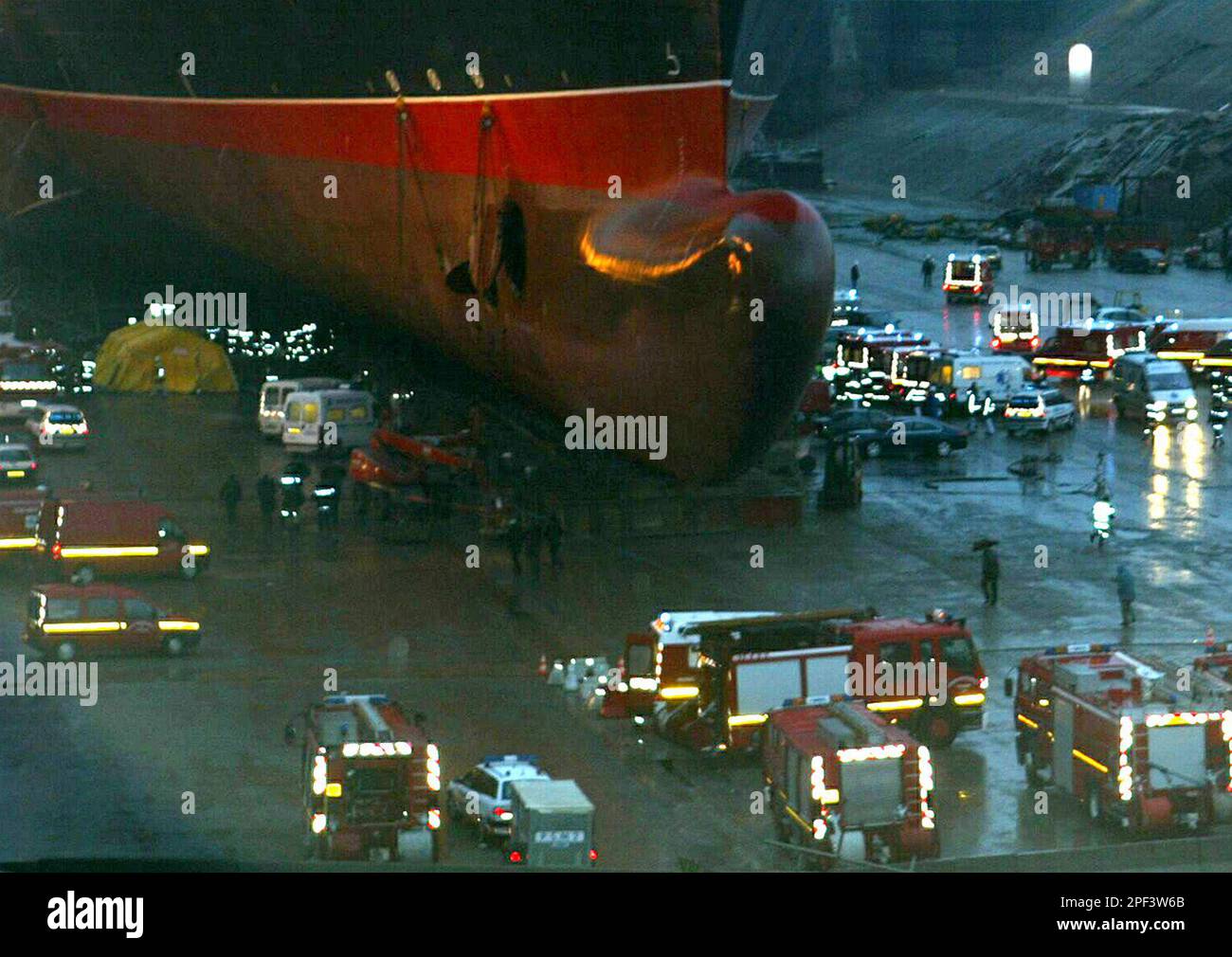 Rescue workers gather at the Queen Mary 2 after a crowded, newly ...