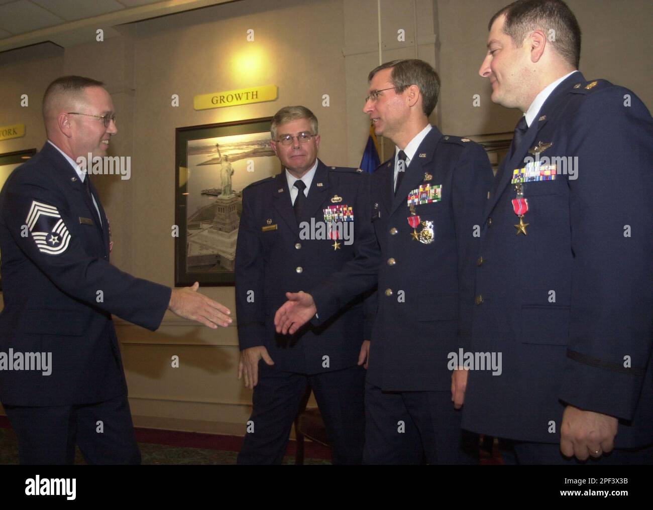 Satnding, from left, Chief Master Sgt. Kenneth Jewell, Jr., Col. Roger ...