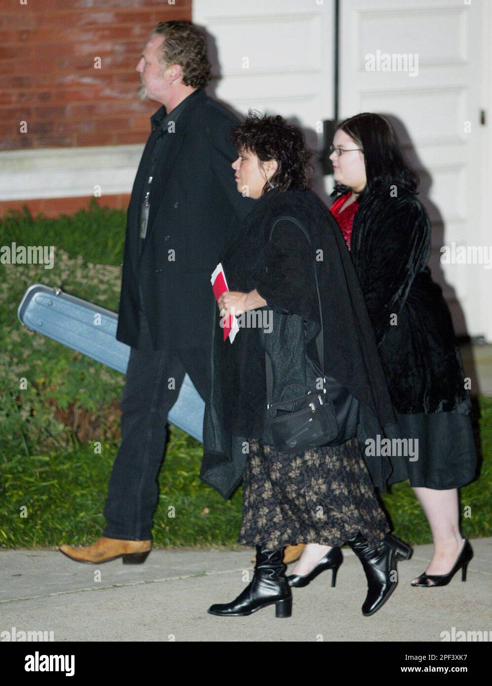 Kathy Cash, daughter of Johnny Cash, center, arrives with her husband ...