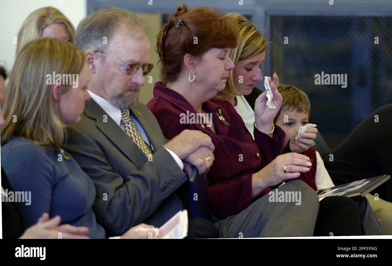 Members of the family of David Travis Friedrich react during a ceremony ...