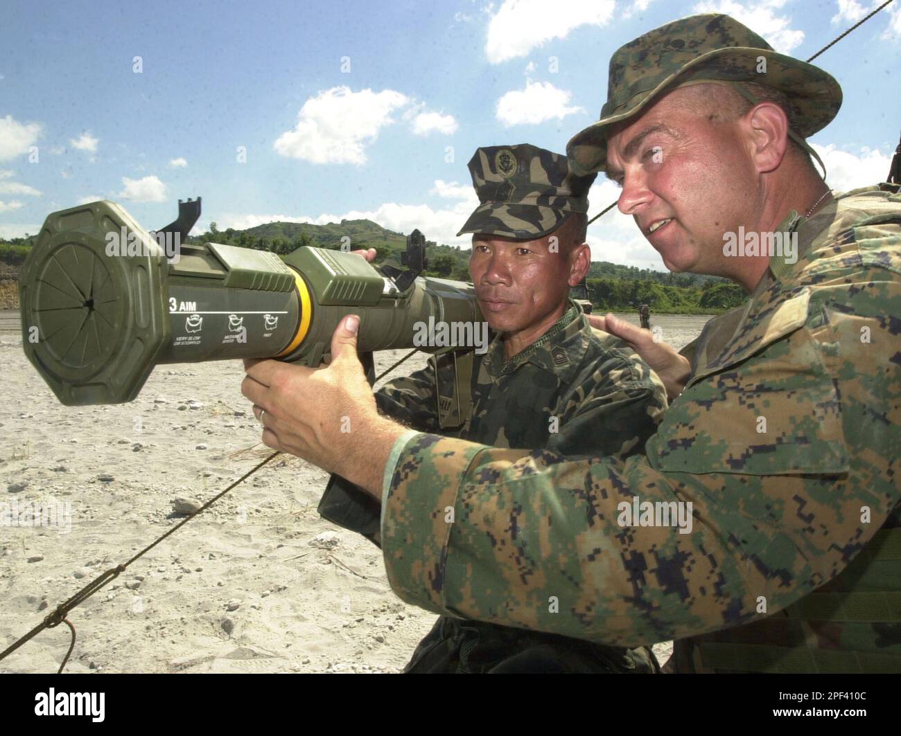 U.S. 1st Sergeant Ron Dickenson, right, from Quitman, Texas, explains ...