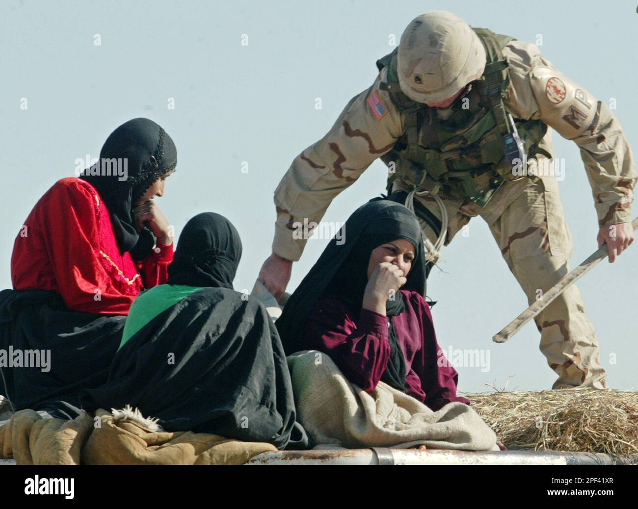 Sgt. John Davies of the 720th Military Police Battalion, right ...