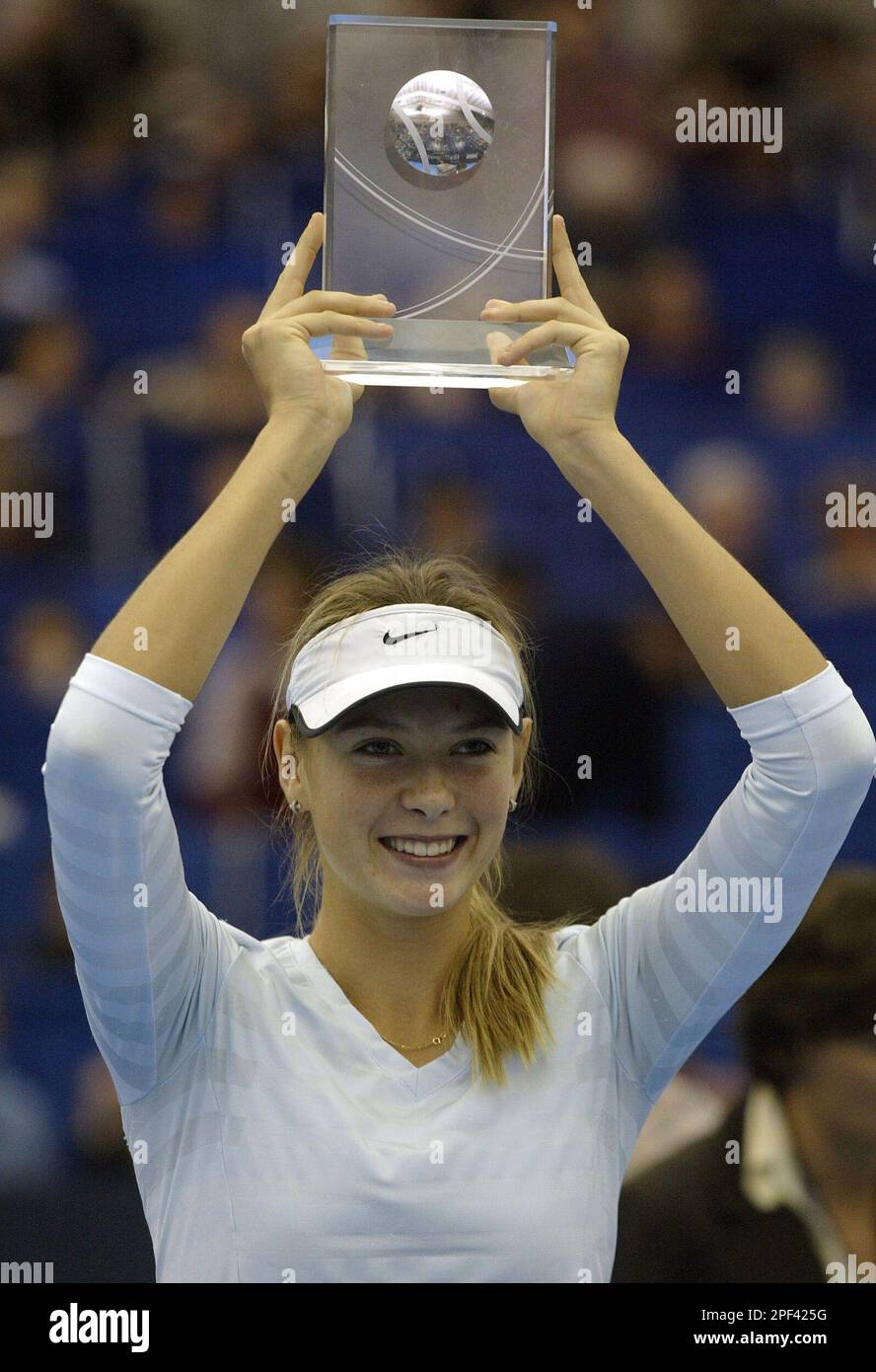 Maria Sharapova, of Russia, raises her trophy after winning the WTA ...