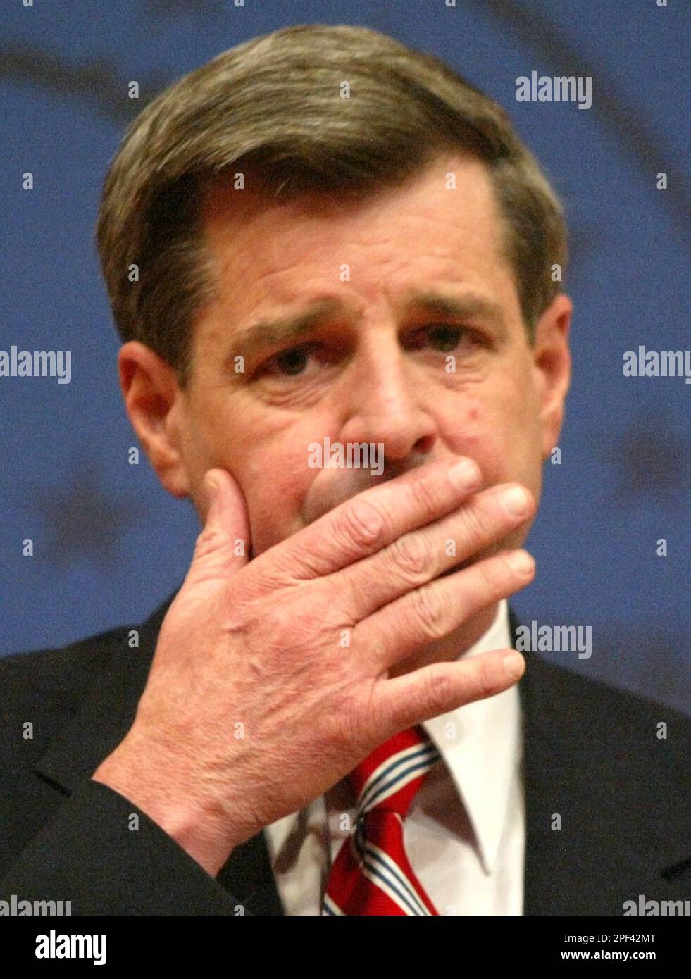 The U.S. chief administrator in Iraq L. Paul Bremer listens to a ...