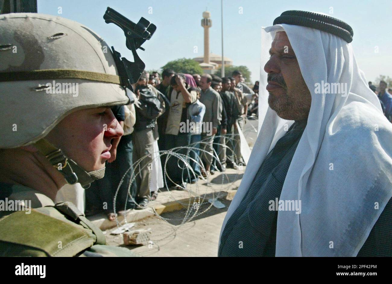 A U.S. Army solider from the 4th Infantry Division guards the gate of a ...