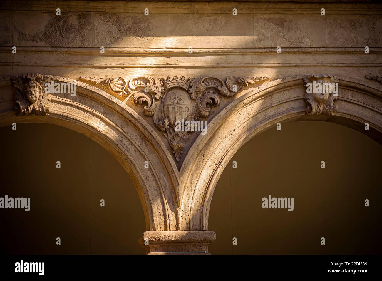 Detail of a semicircular arch in the cloister of a Renaissance palace ...