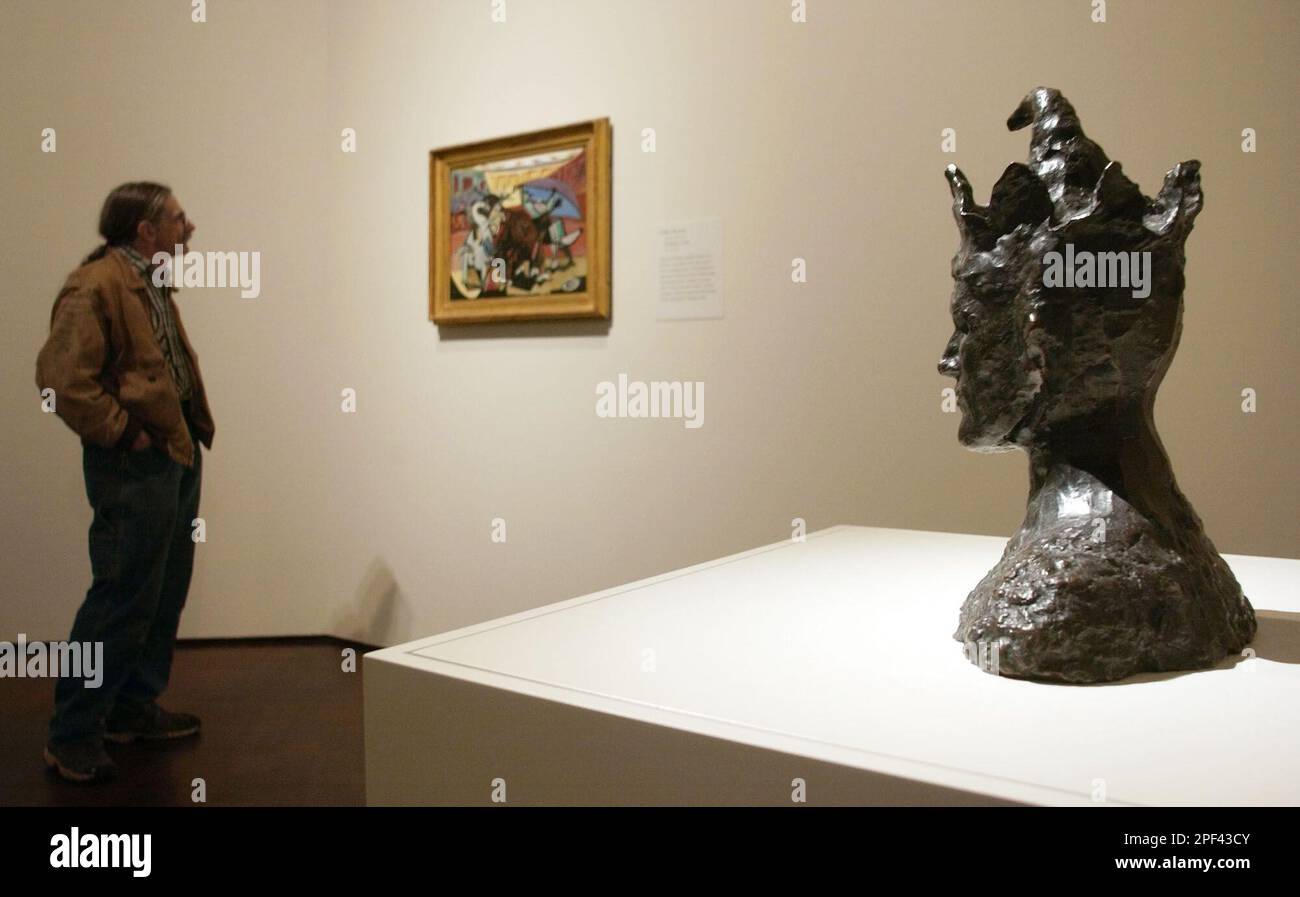 A sculpture named "The Jester" done in 1905, is shown next to a gallery ...