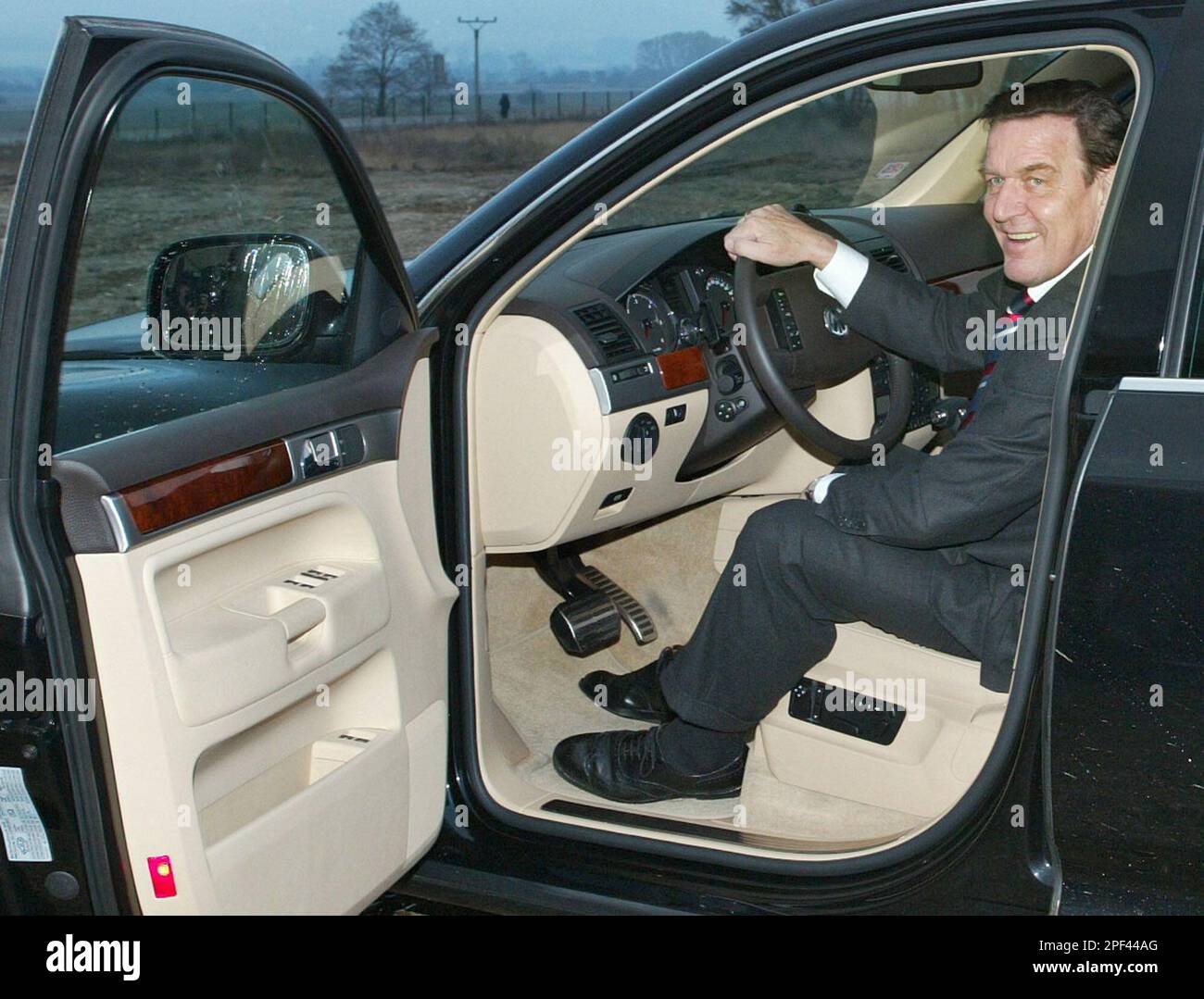 German Chancellor Gerhard Schroeder sits in a Volkswagen Touareg car ...