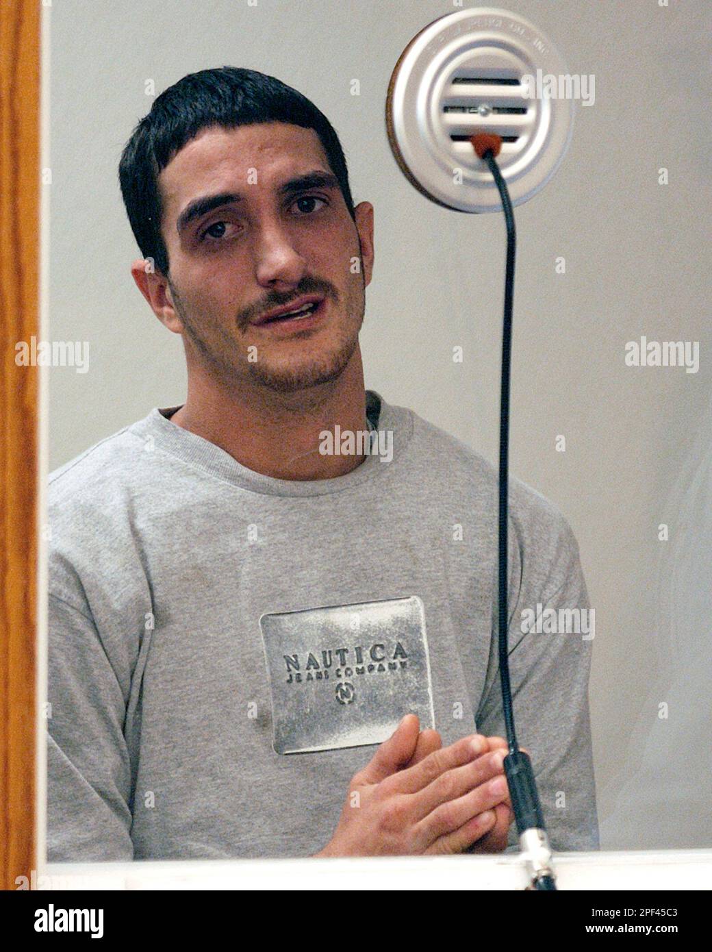 Eric Durand, of Somerset, Mass., stands in the prisoner's dock of the ...