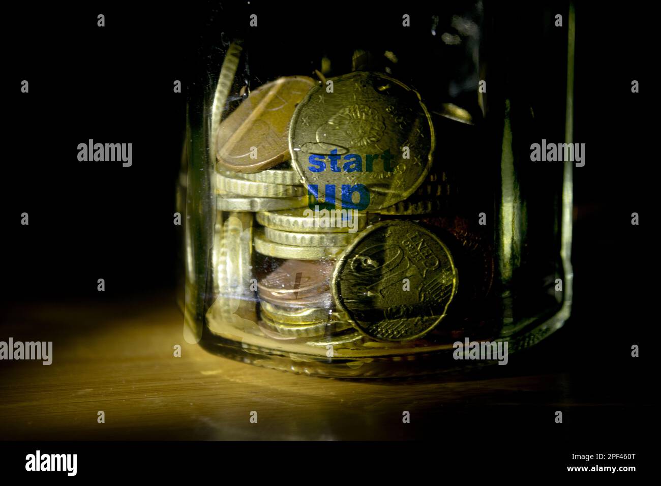 concept of startup with money in a jar Stock Photo - Alamy