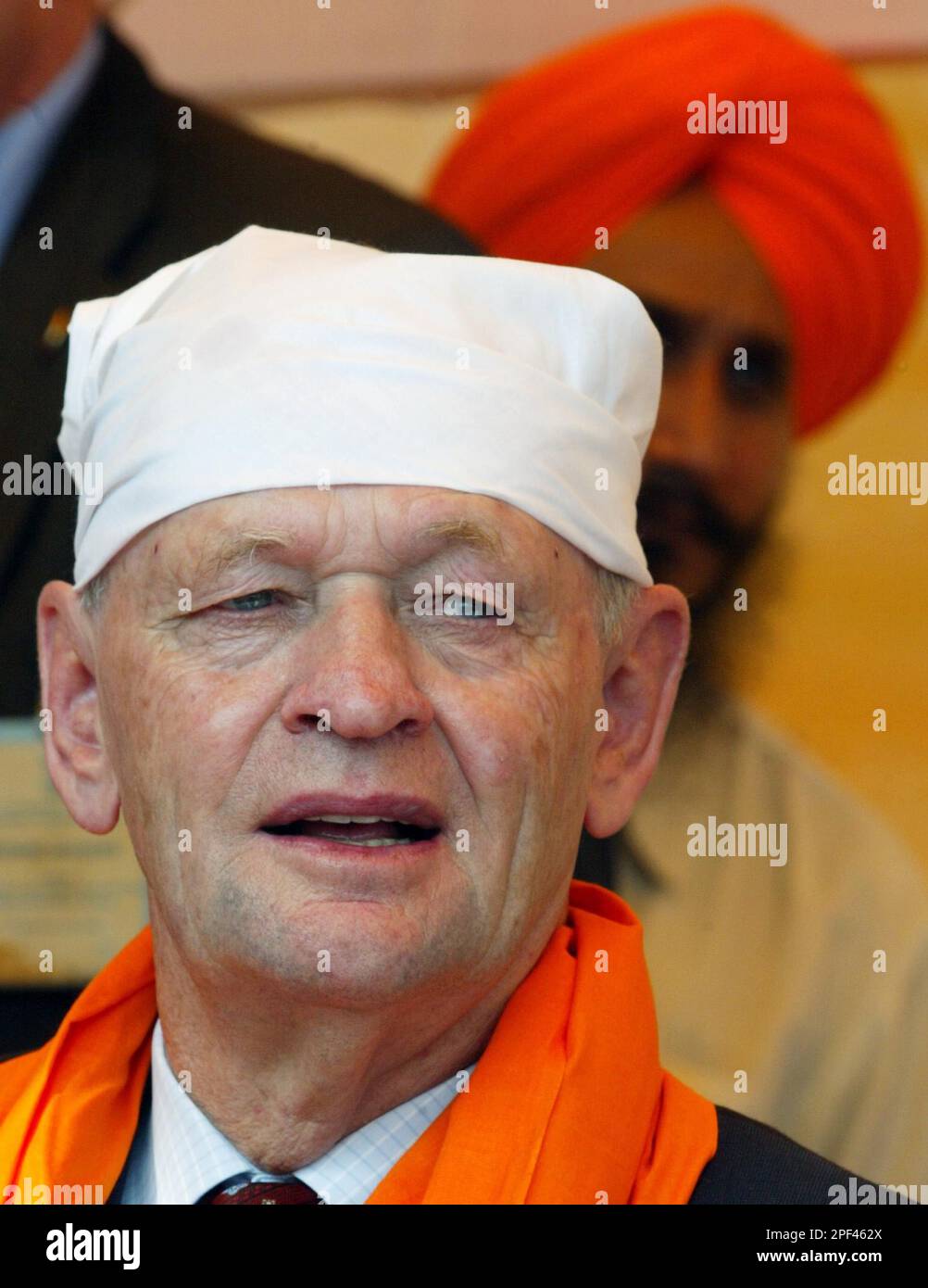 Prime Minister Jean Chretien wears headdress during his visit to the ...