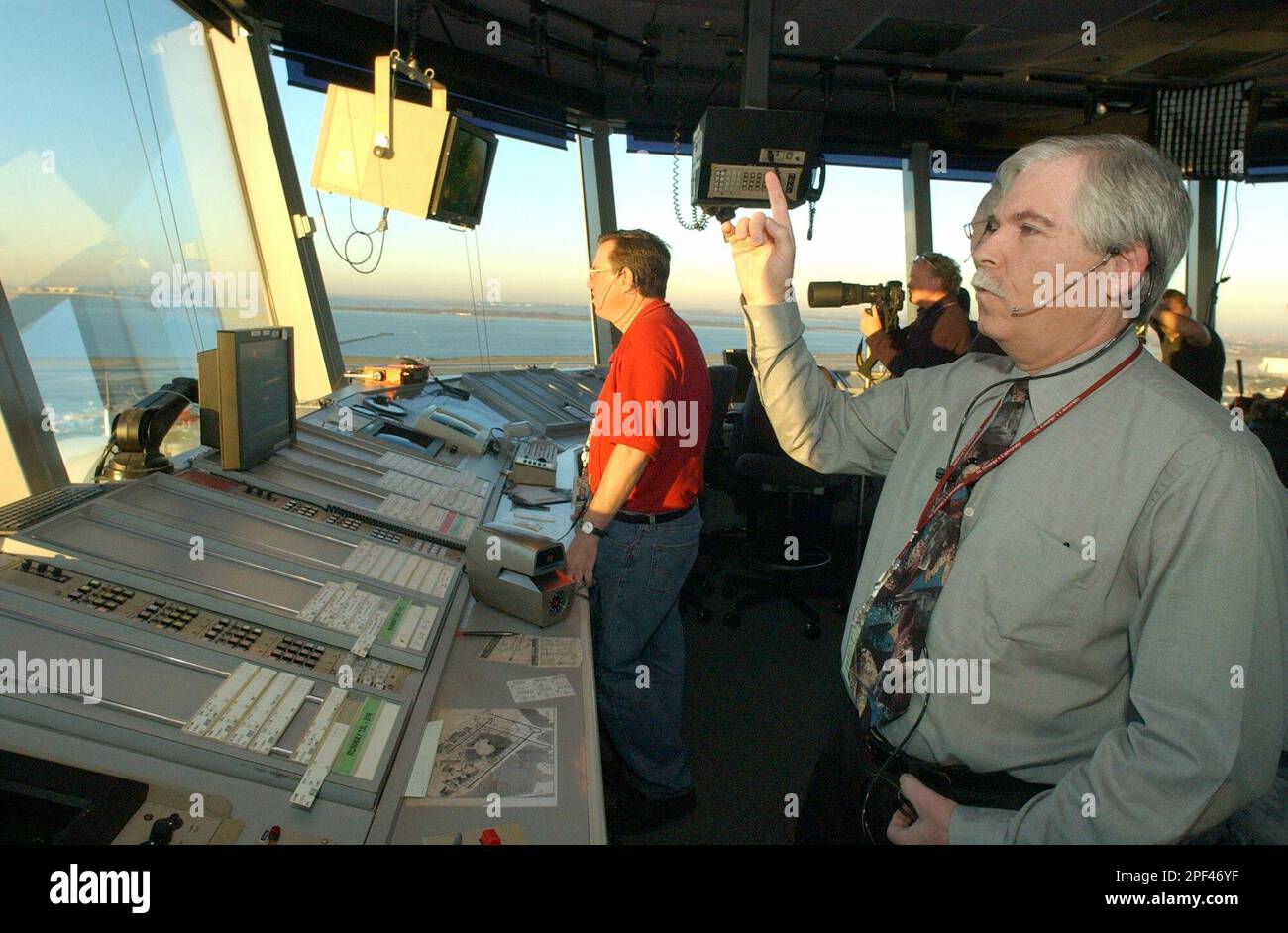 Flight controller Sam Kohn, right, gives takeoff permission from the ...