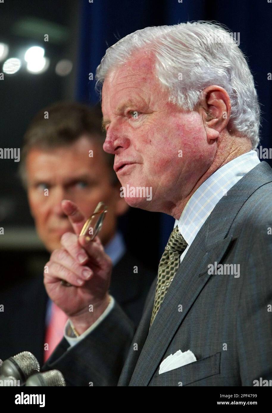 Senate Minority Leader Tom Daschle of S.D., left, looks on as Sen ...