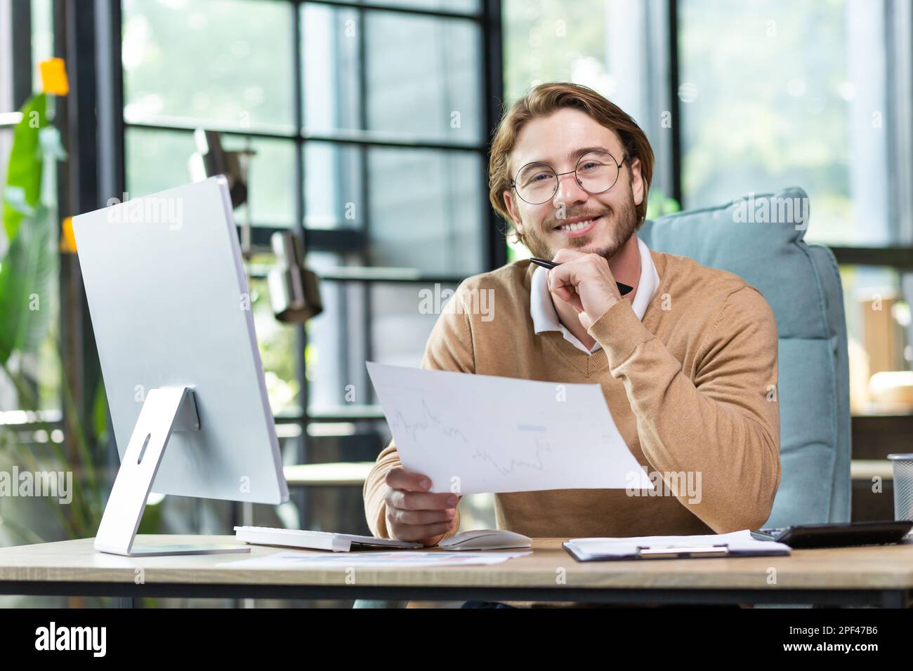 Man designer checking documents hi-res stock photography and images - Alamy