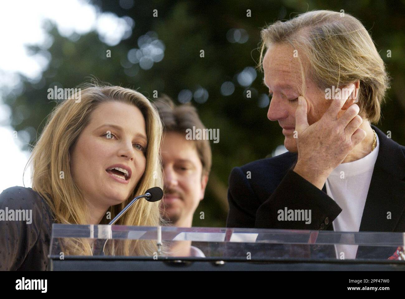 Actor and director Peter Fonda, right, wipes away a tear as his ...