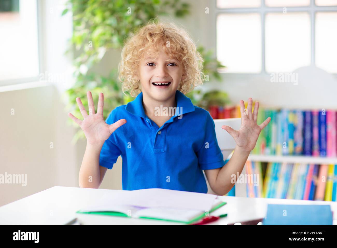 School child doing homework. Online remote learning from home. Kids ...