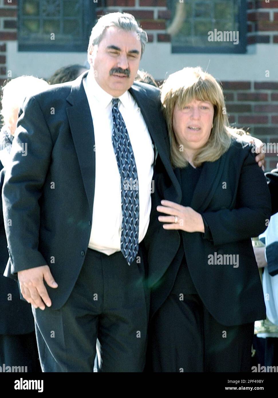 Vincent Ferrante Sr. and his wife Michelle leave the funeral service ...