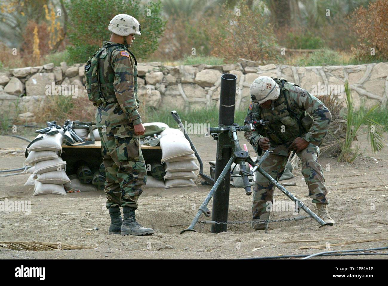 U.S soldiers from the 4th infantry division set up a mortar position ...