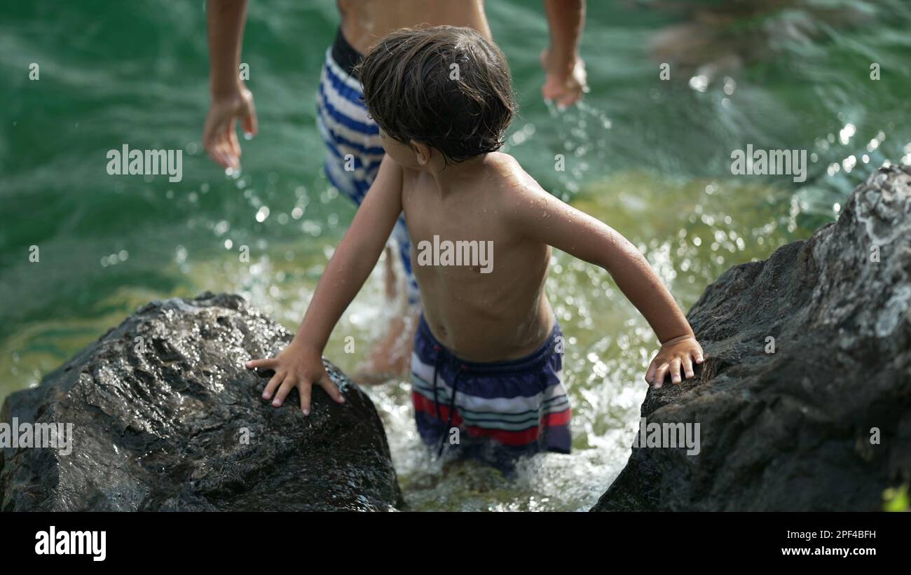 Kids holding rocks hi-res stock photography and images - Alamy