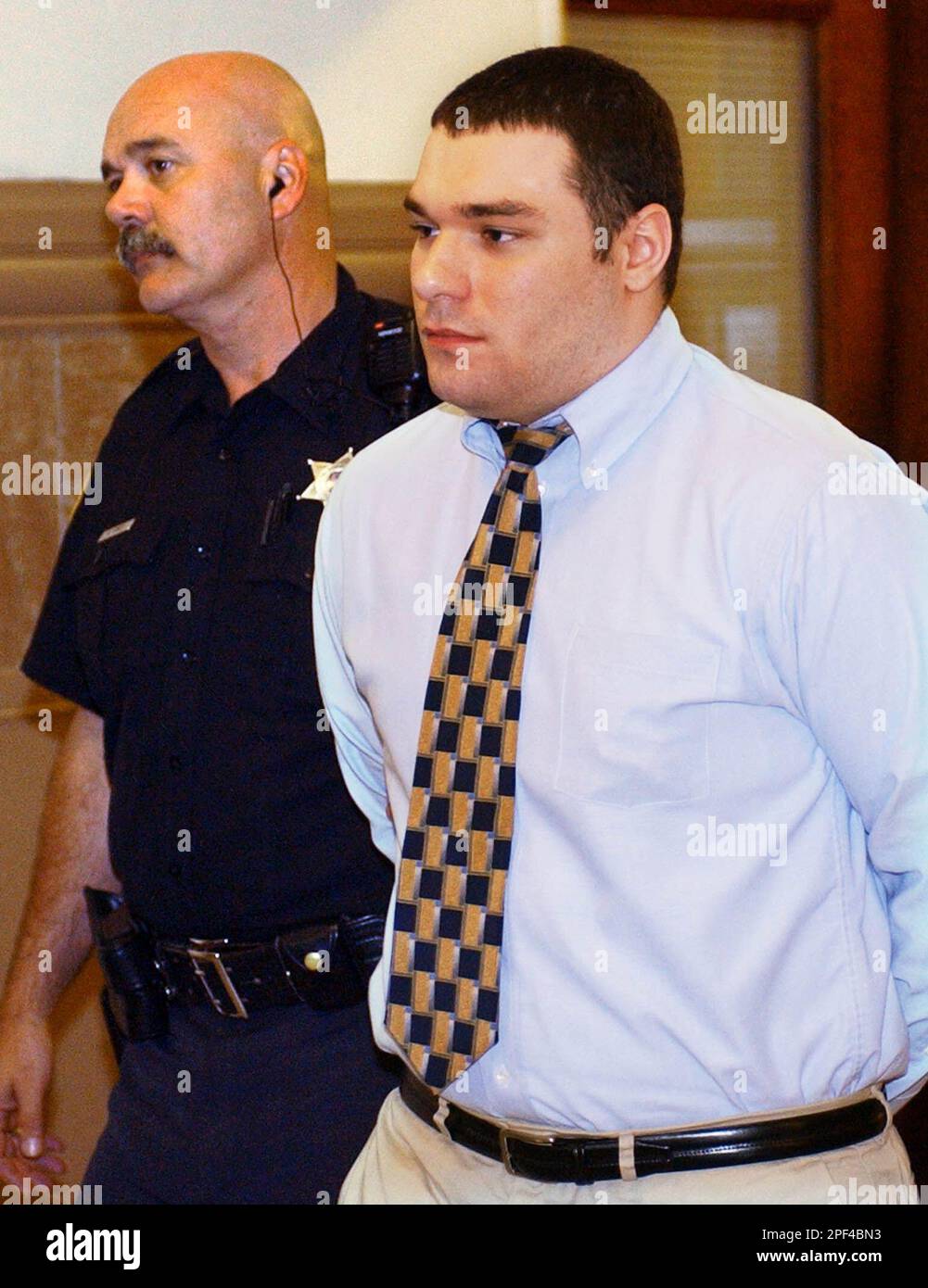 Jared Lischner, right, is led from court by an Allegheny County ...