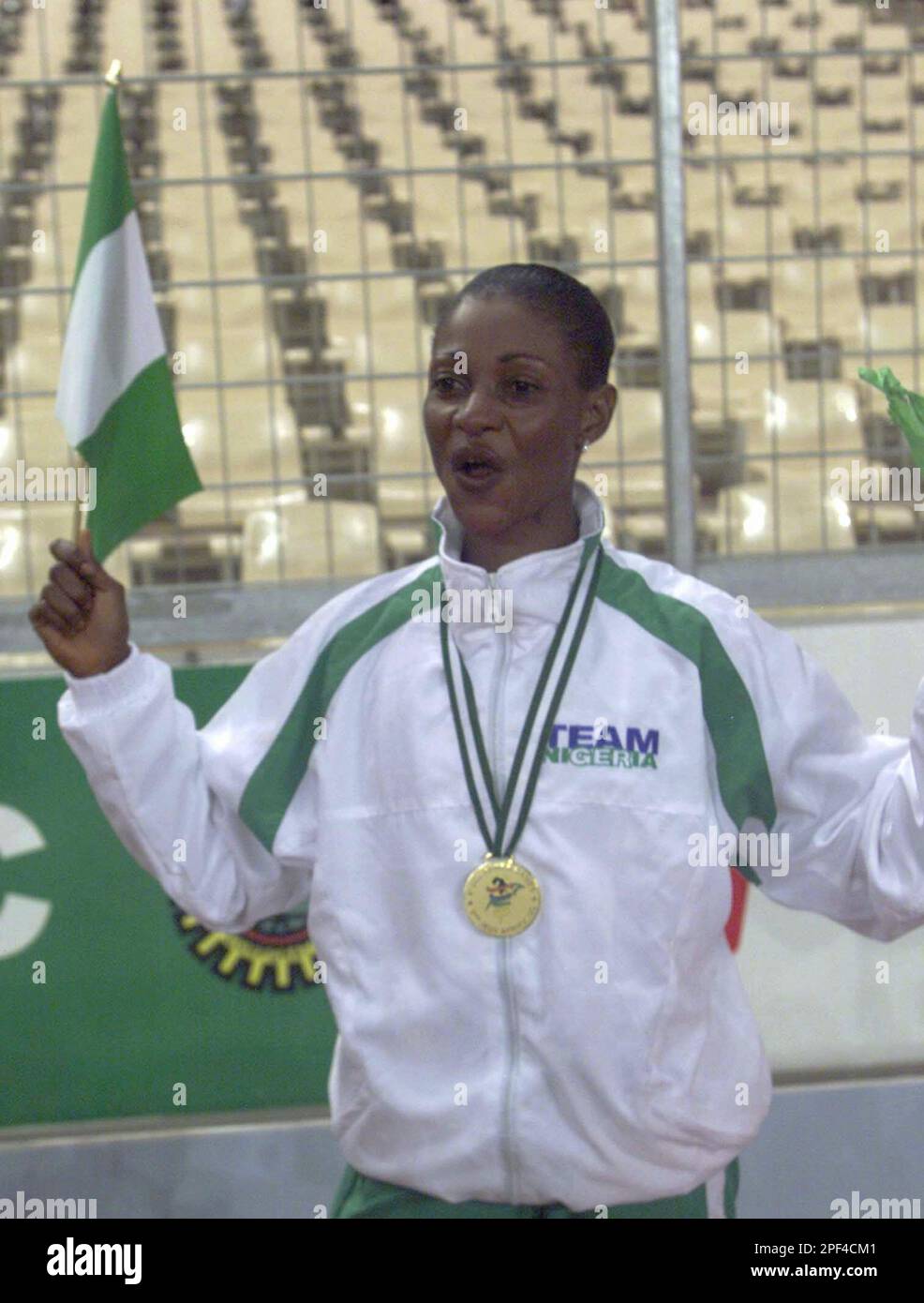 Mary Omagbemi of Nigeria celebrates after receiving her gold madal in ...