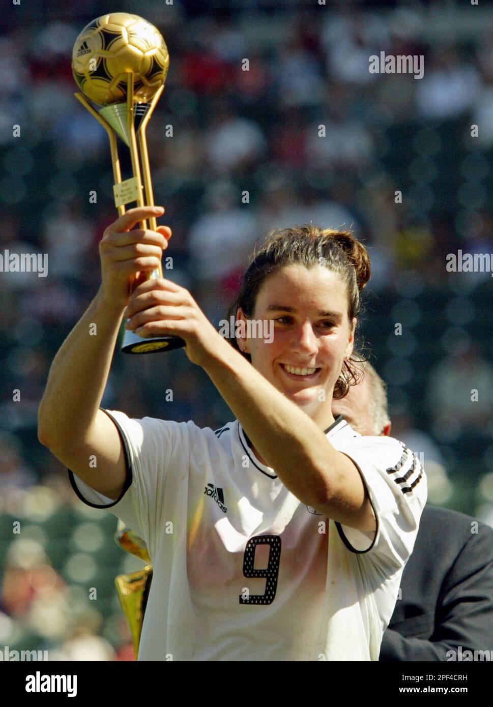 Germany's Birgit Prinz holds up the Golden Ball Award for the most ...