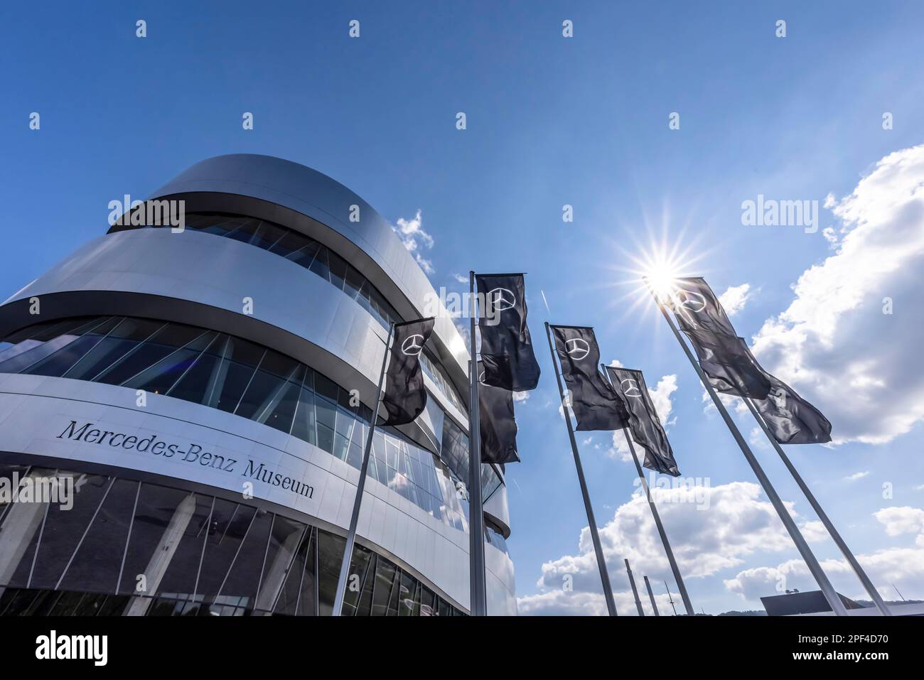Mercedes Benz Museum with black flags with Mercedes star, exterior view ...