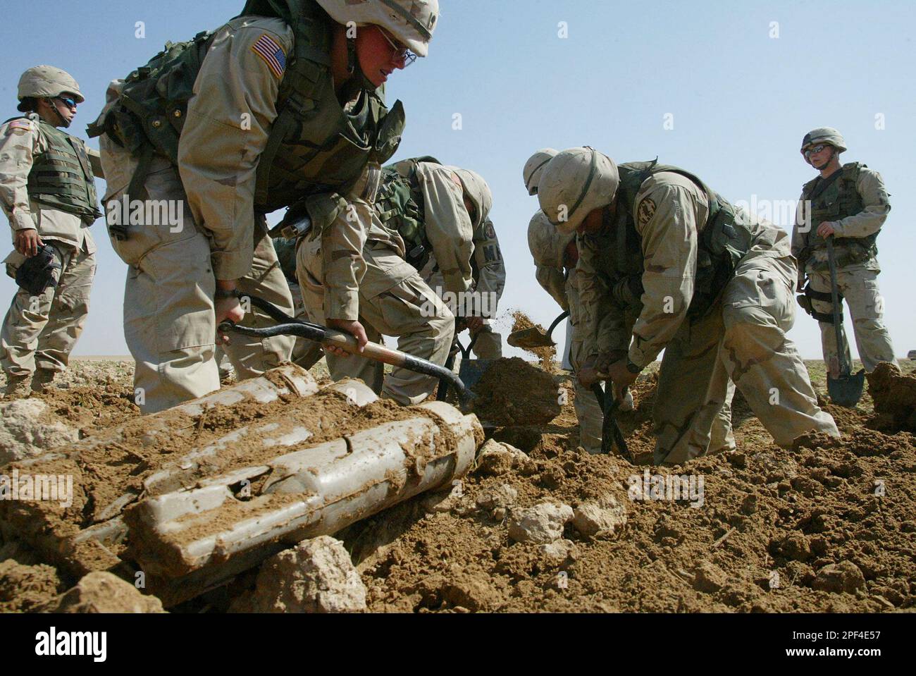 Soldier from the U.S. Army's 720th Military Police Battalion dig for ...