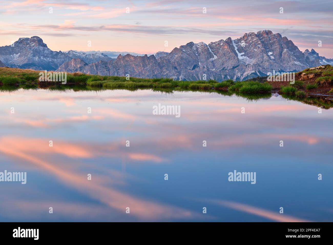Pond with mountain panorama, sunrise, Passo Giau, Dolomites, Belluno ...