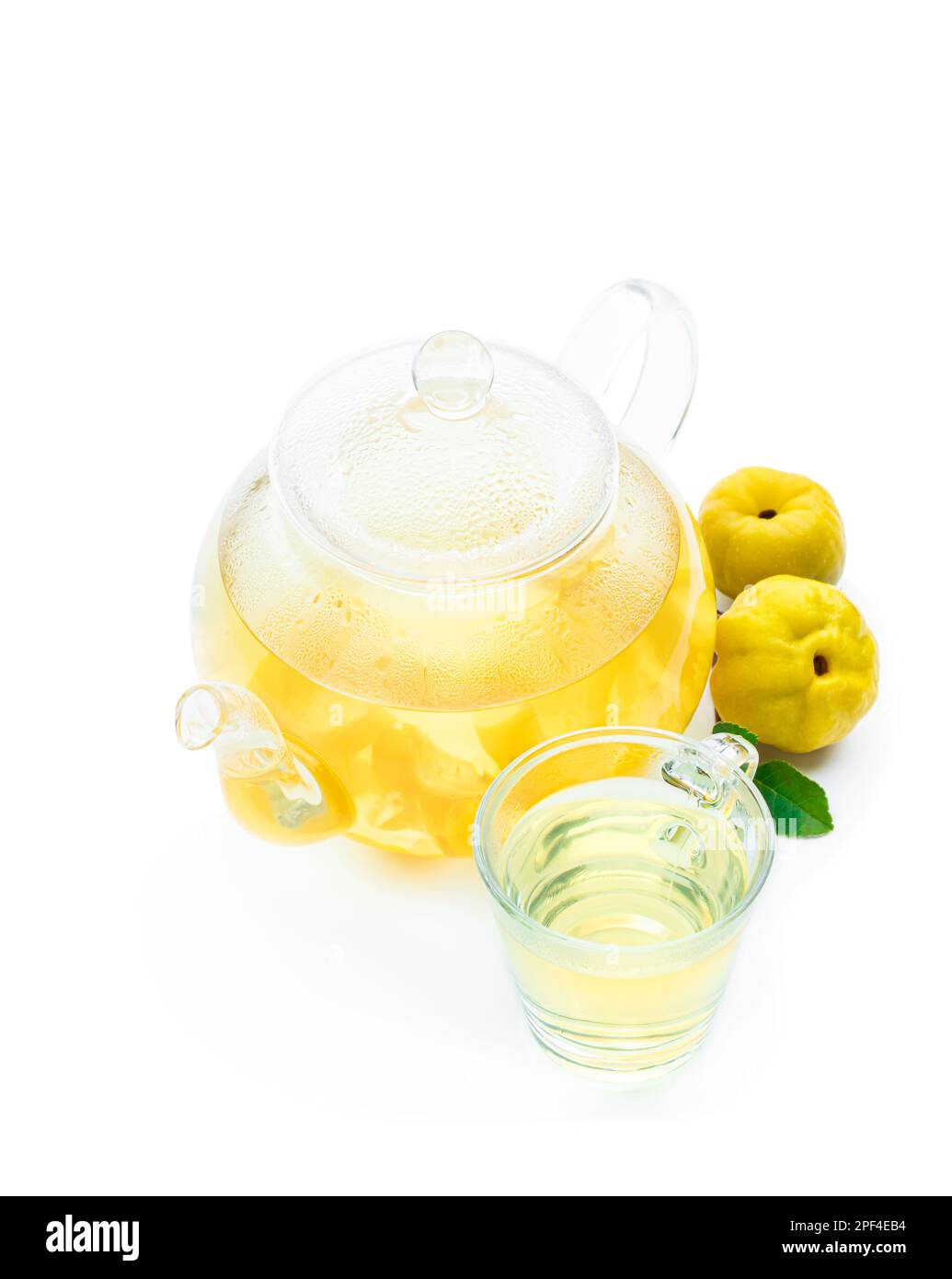 Hot quince tea in transparent teapot with fresh fruits isolated on ...