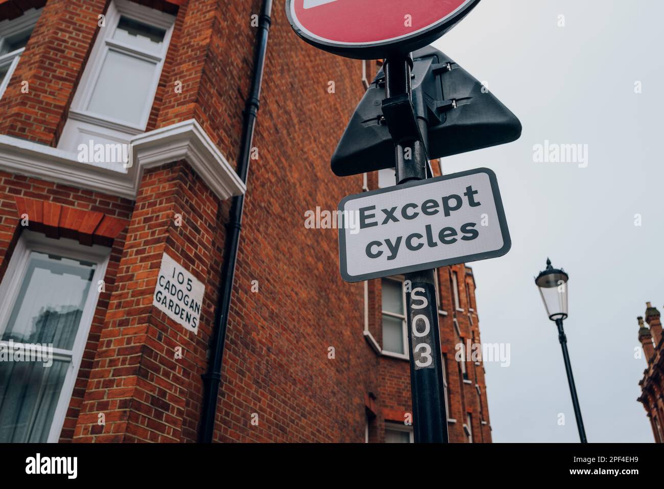 Low angle view of No Entry Except Cycles sign on a street in Kensington ...