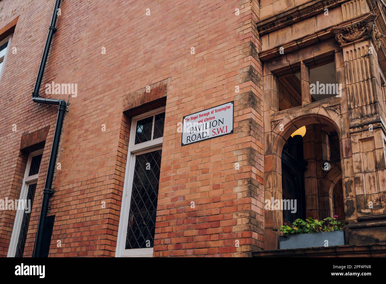 Street name sign on a wall of a building on Pavilion Road in The Royal ...