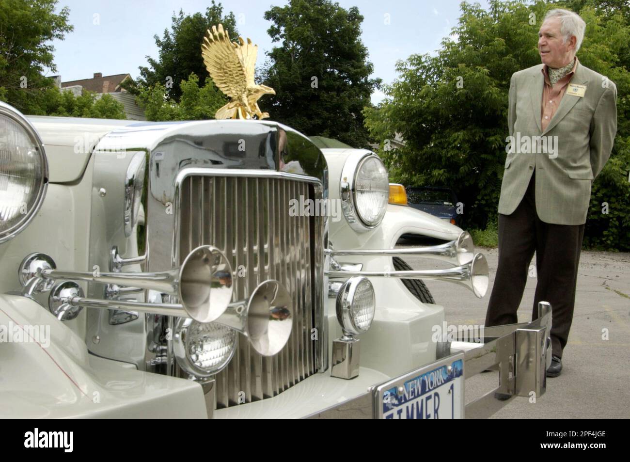 Art Zimmer, owner of the Zimmer Motor Car Company, is pictured with a ...