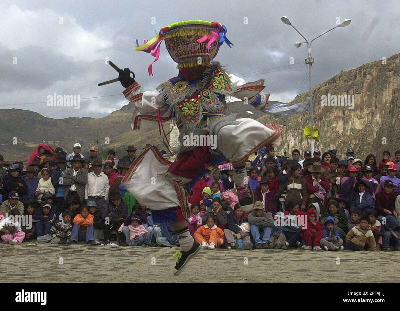 Scissors dancer Mario Huamani performs on the plaza of the small Andean ...