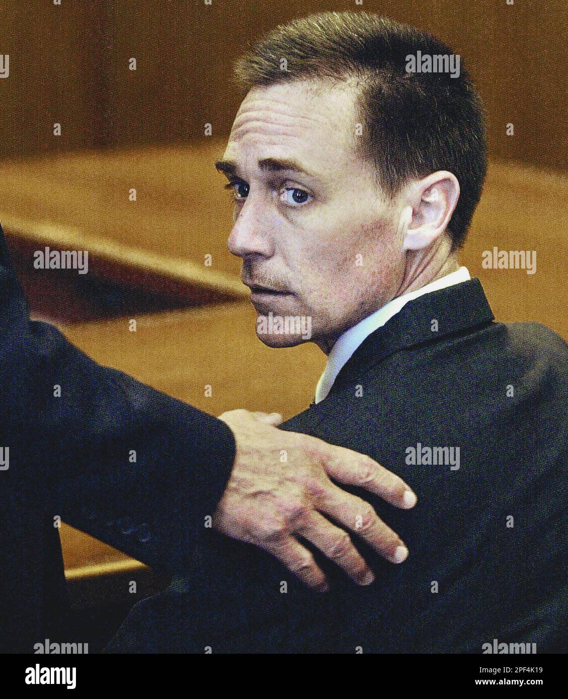 The Rev. Mike Tabb looks around the courtroom and is consoled by his ...