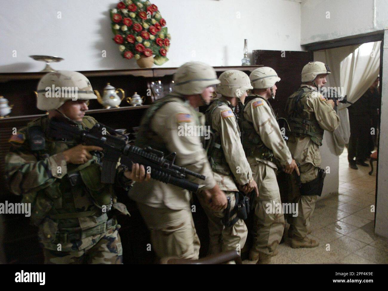 Members of the U.S. Army's 720th Military Police Battalion enter a ...