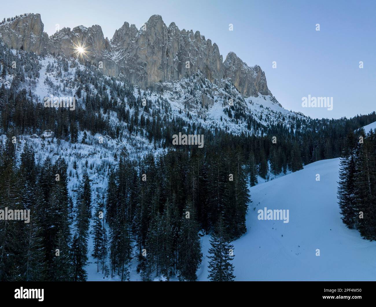 Sun shining through grandmother hole, erosion gap in the saddle tips ...