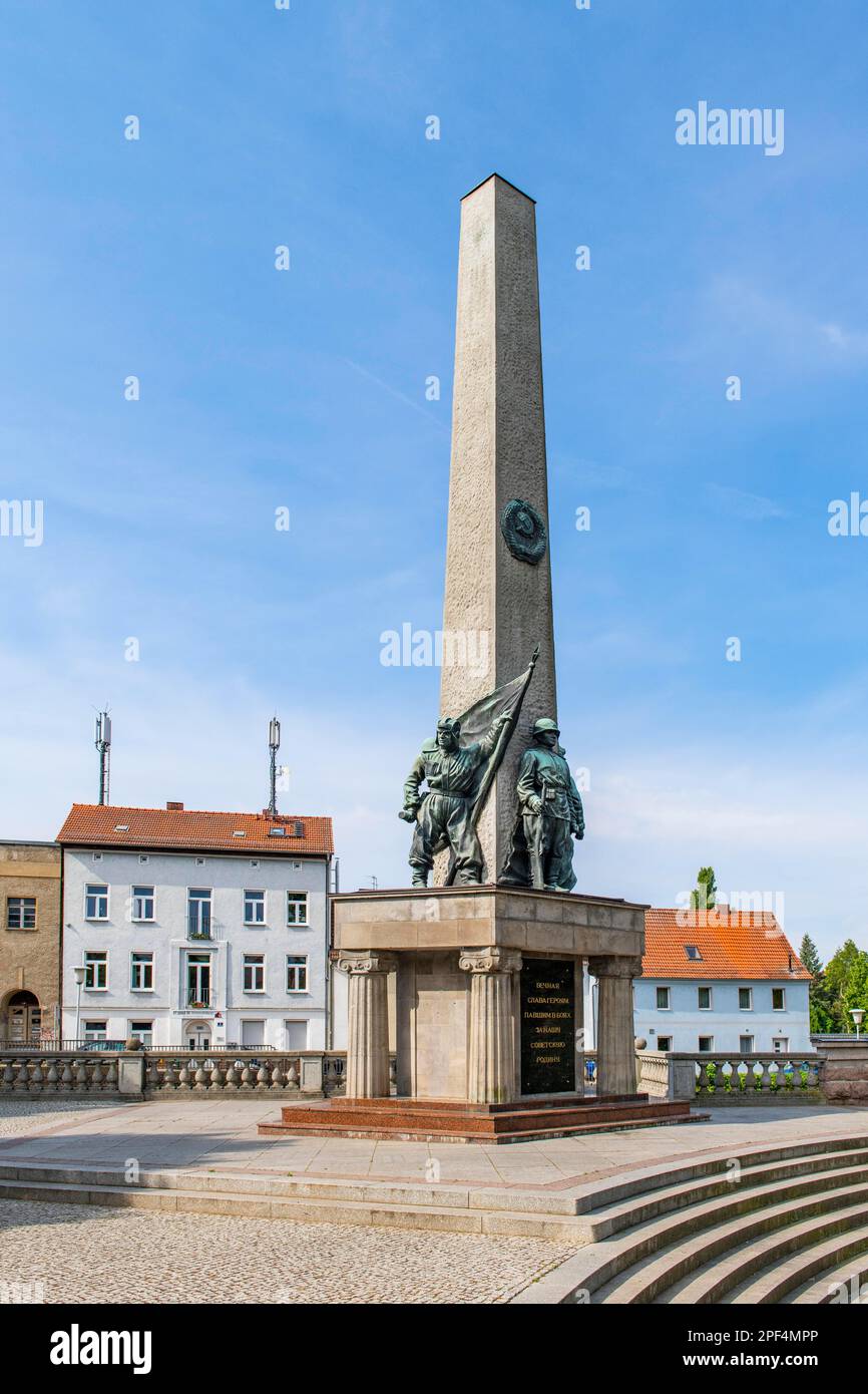 Soviet memorial with bronze figures of Russian soldiers and obelisk ...