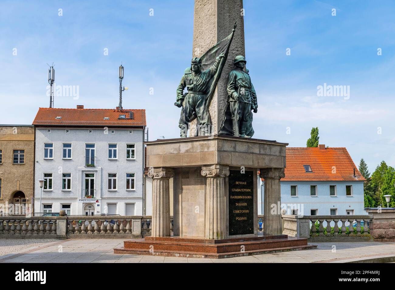 Soviet memorial with bronze figures of Russian soldiers and obelisk ...