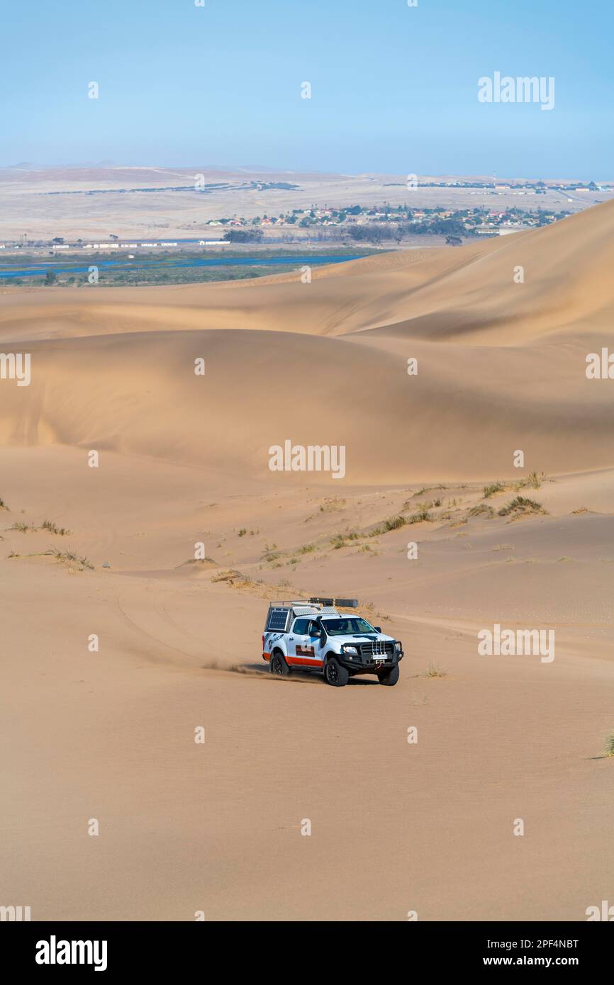Off-road vehicle in sand dunes above the Orange River, also Oranjemund, Sperrgebiet National ...