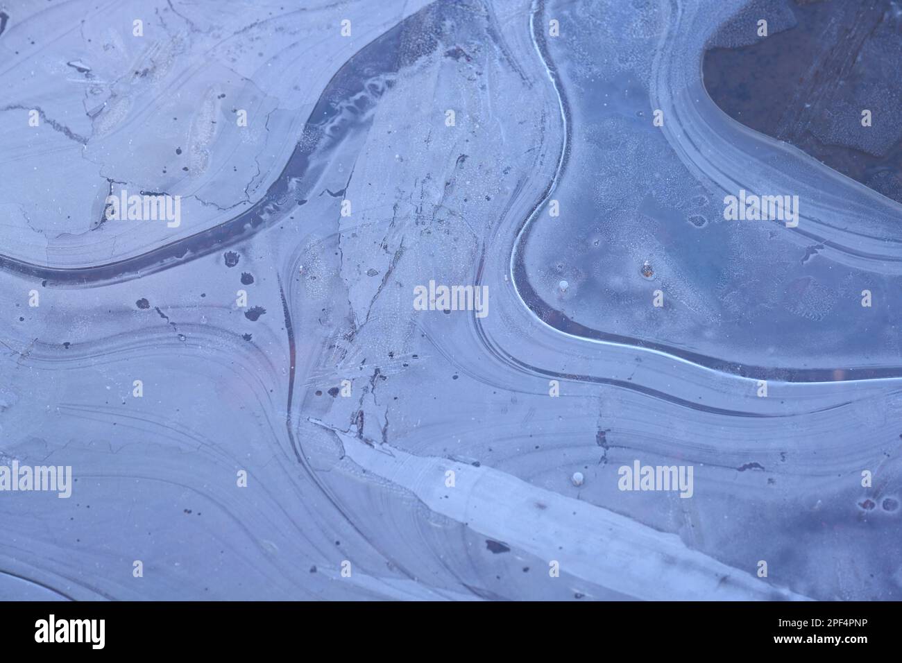 Frozen water patterns and textures, from a small frozen stream in the ...