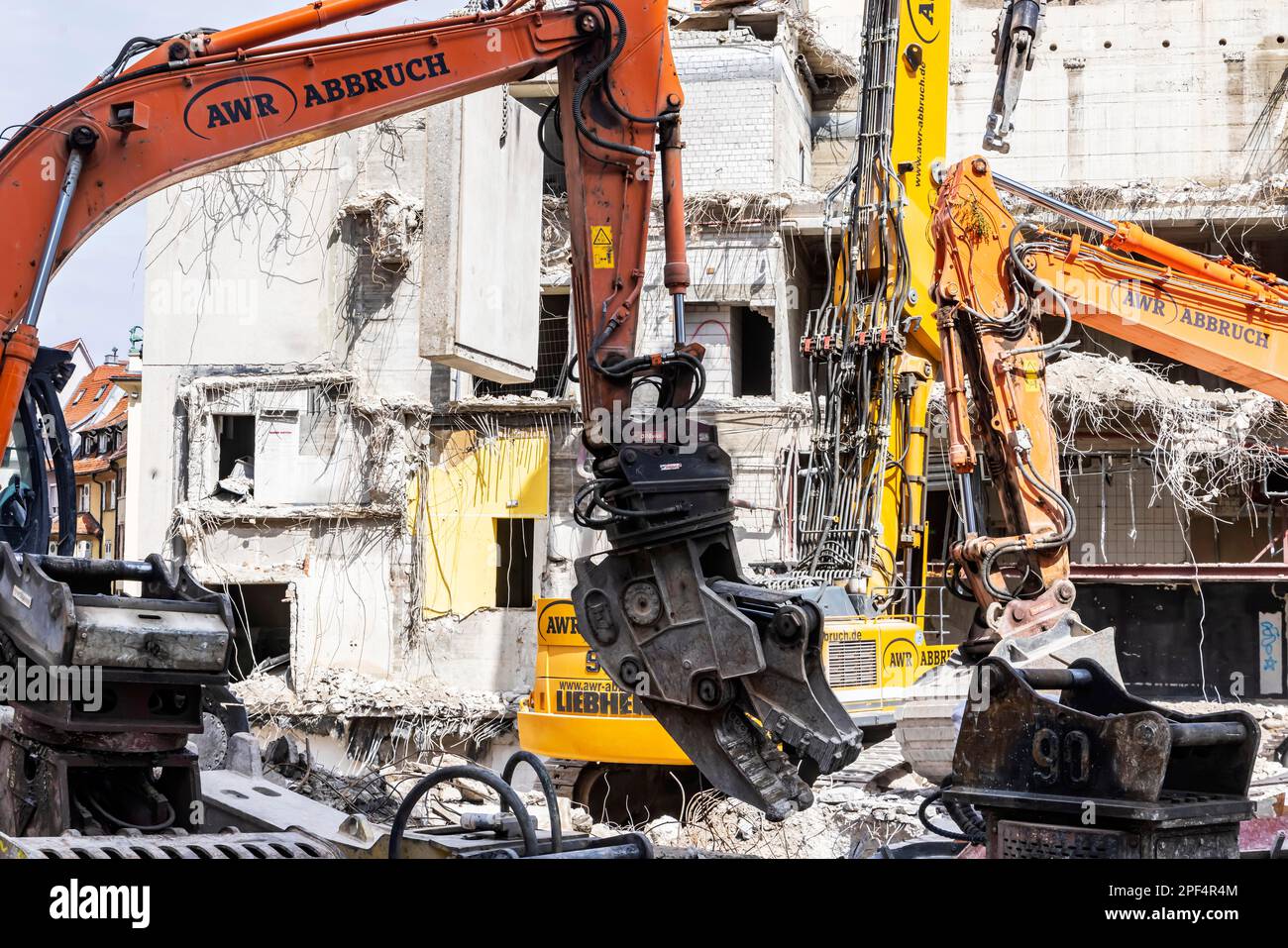 Demolition of a building, demolition excavator during the ...