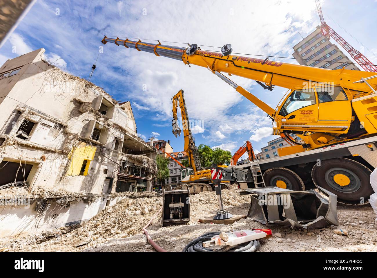 Demolition of a building, demolition excavator during the ...
