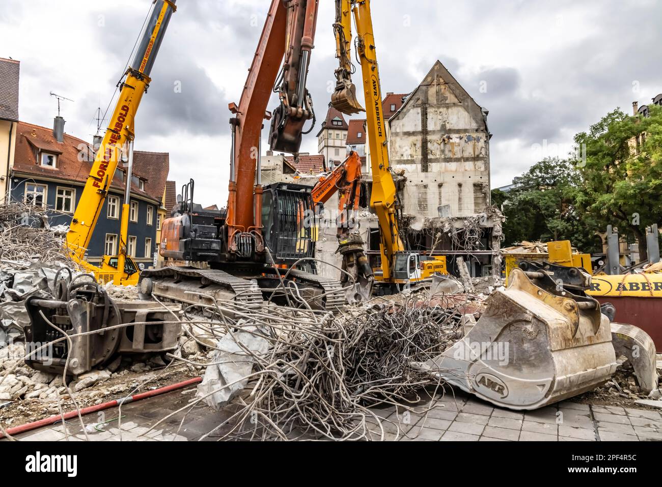 Demolition of a building, demolition excavator during the ...
